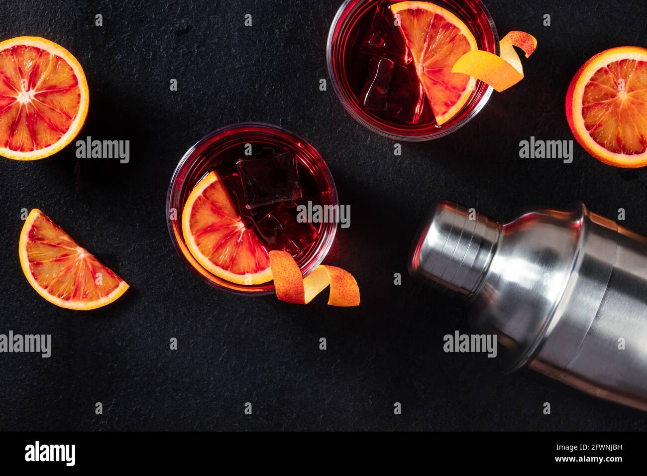 Orange cocktails with a shaker, shot from the top with a place for text ...