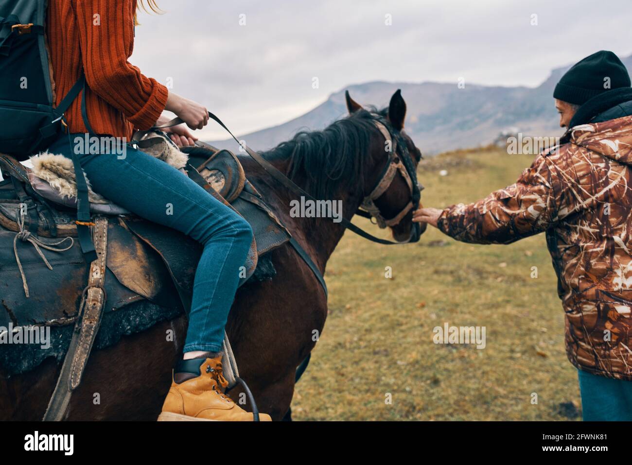 woman hiker with backpack riding horse landscape mountains fresh air ...