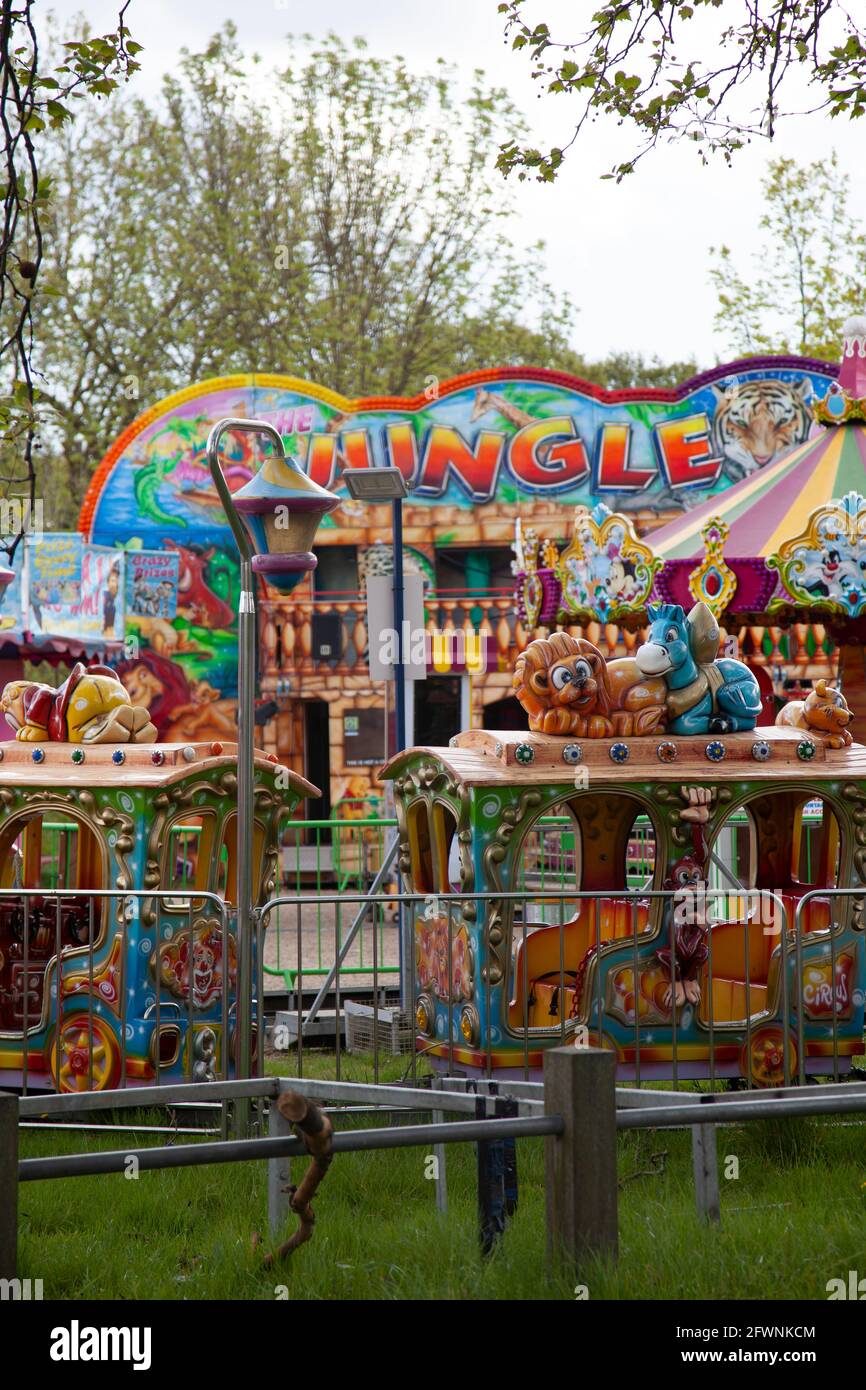 Fairground Behind Fence on Clapham Common, London UK Stock Photo - Alamy