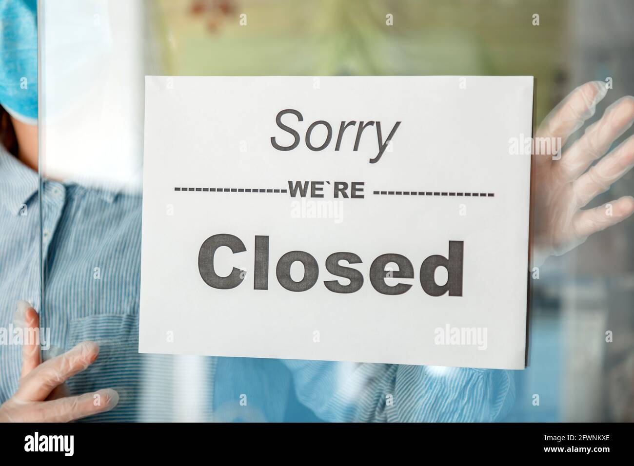 Sign Sorry we re closed on shop entrance door as new normal shutdown ...