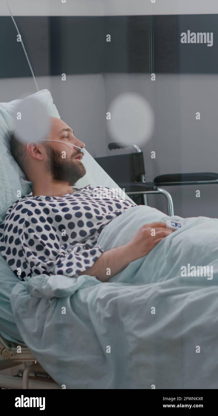 Medical nurse explaining bones radiography to hospitalized sick man ...