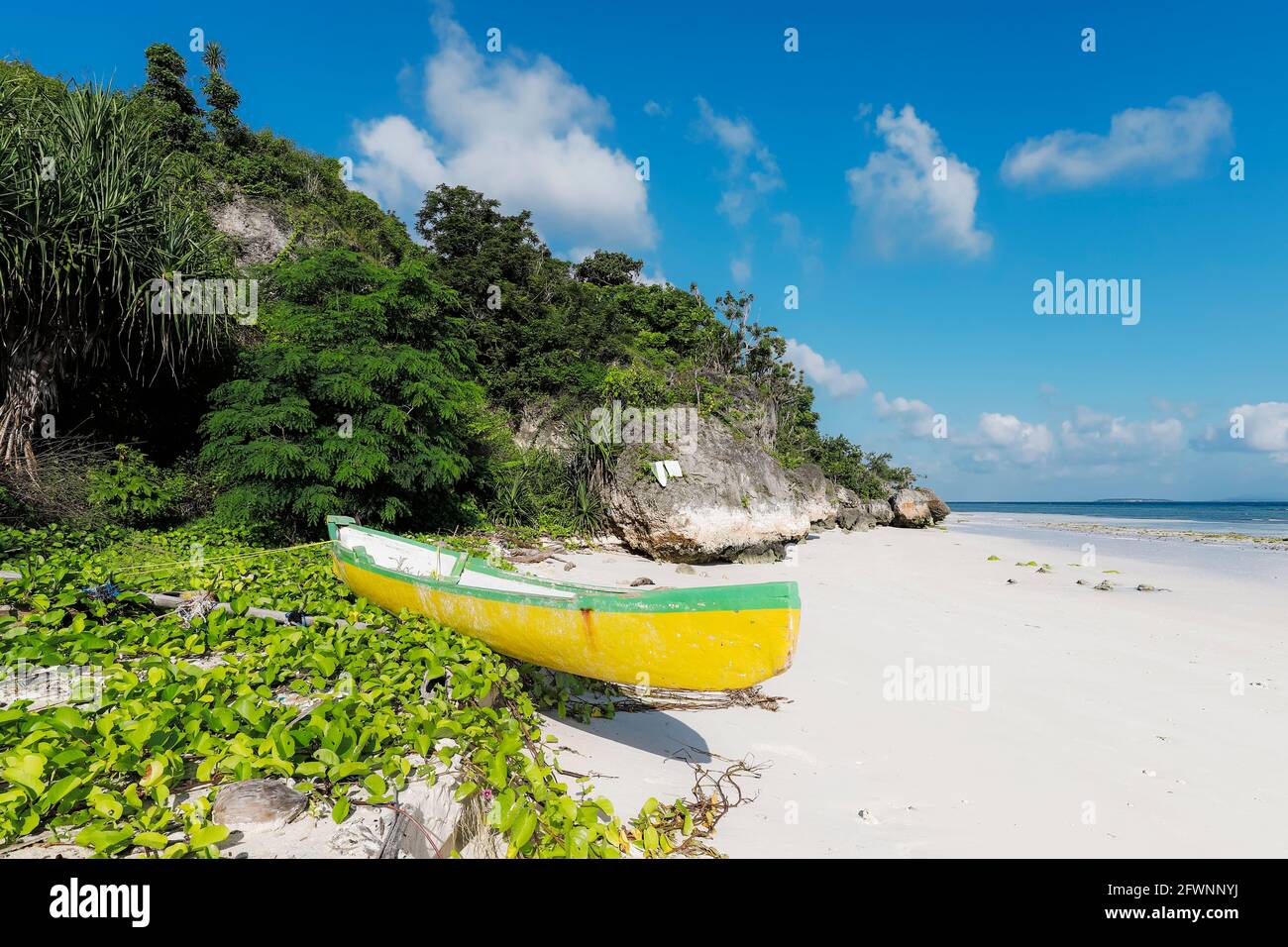 Colourful old canoe on beautiful white sand Bira Beach at this far ...