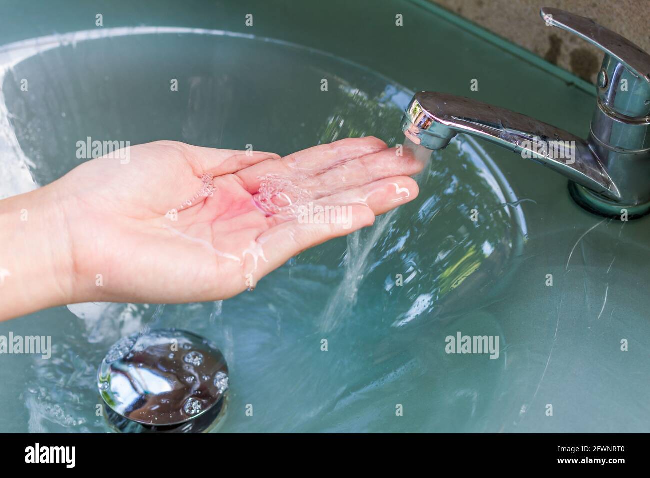 girl washing her hand out door Stock Photo - Alamy