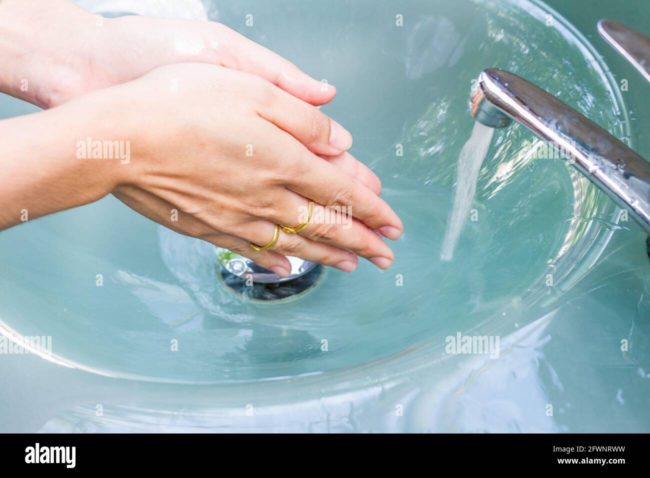 girl washing her hand out door Stock Photo - Alamy