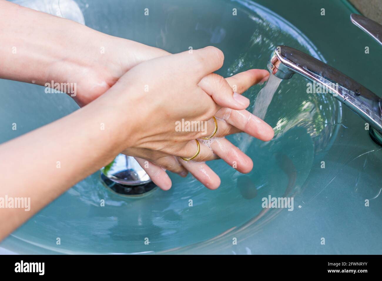 girl washing her hand out door Stock Photo - Alamy