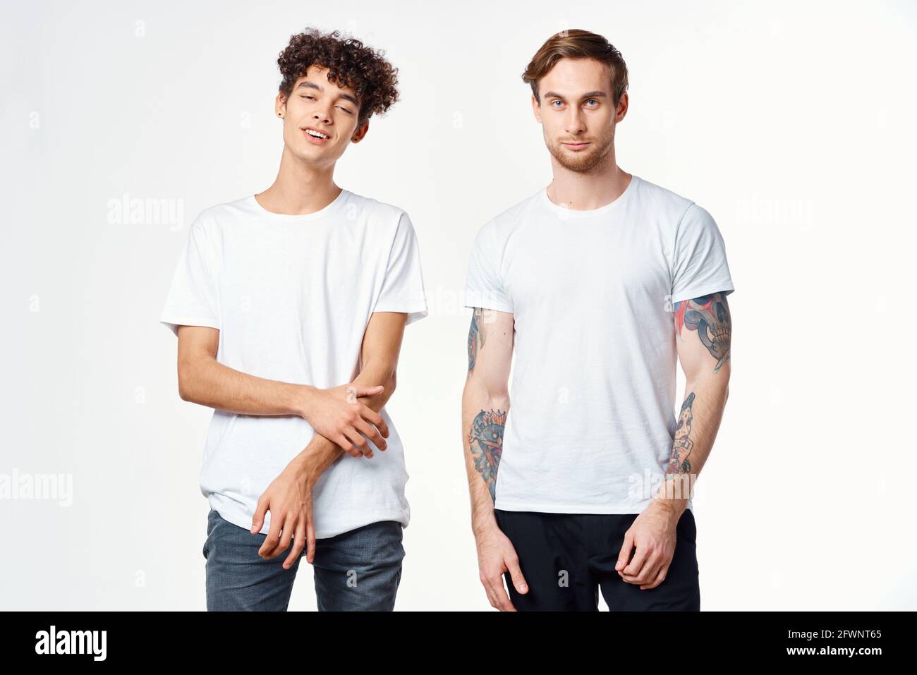 two funny friends in white t-shirts laughing positive emotions Stock ...
