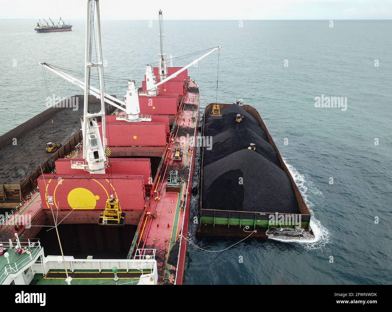 Aerial and assisting barge boat boating cargo carrying coal crane hi ...