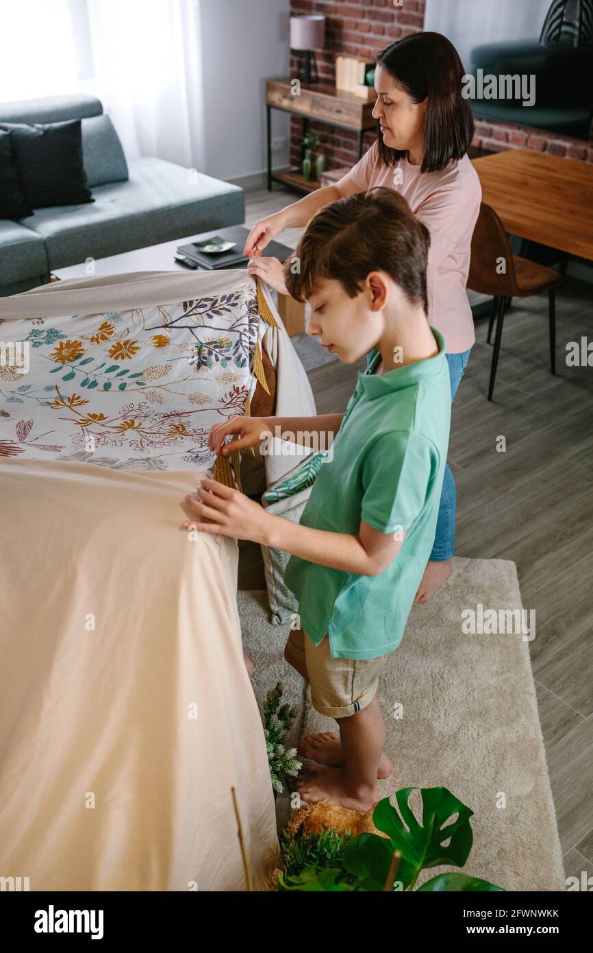 Mother and son preparing tent to camping at home Stock Photo - Alamy