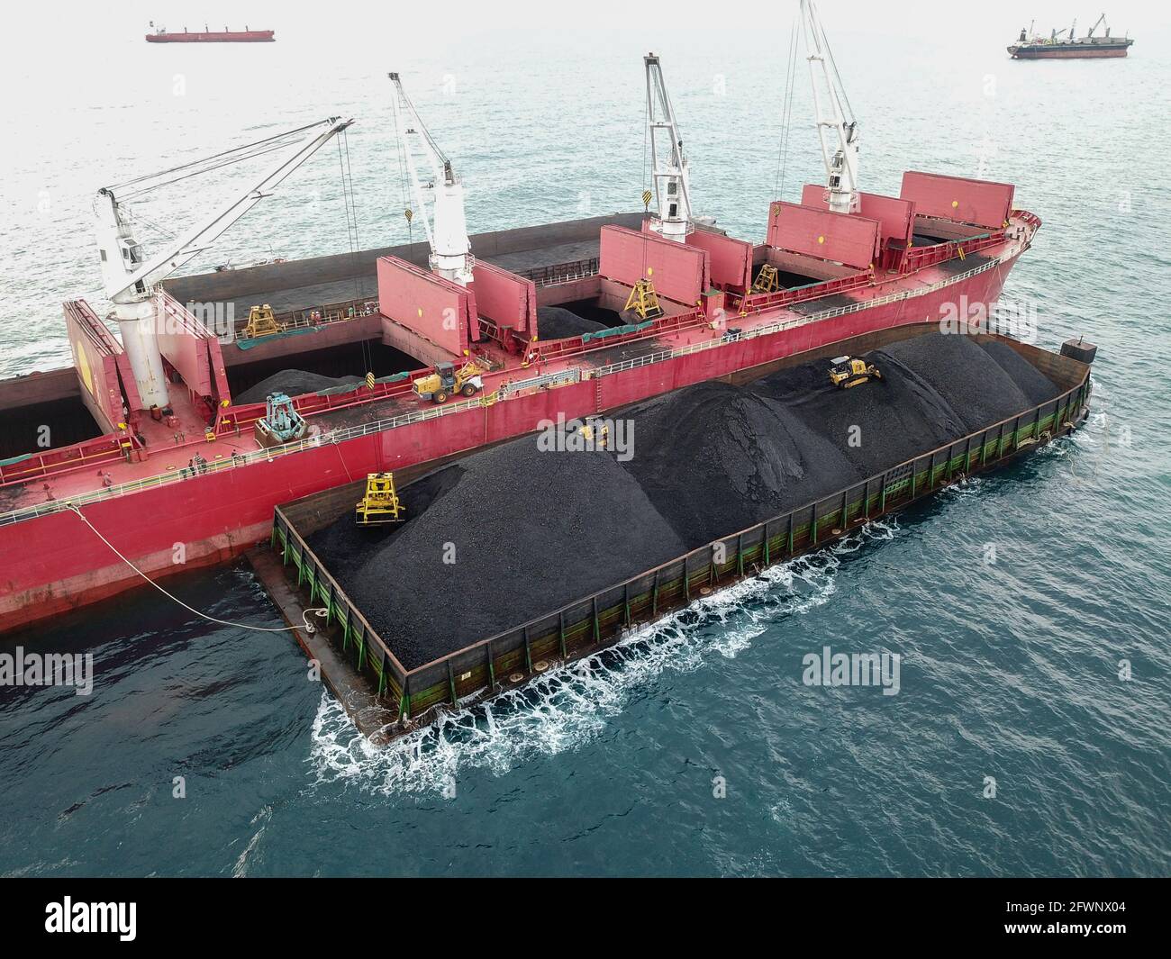 Aerial and assisting barge boat boating cargo carrying coal crane hi ...