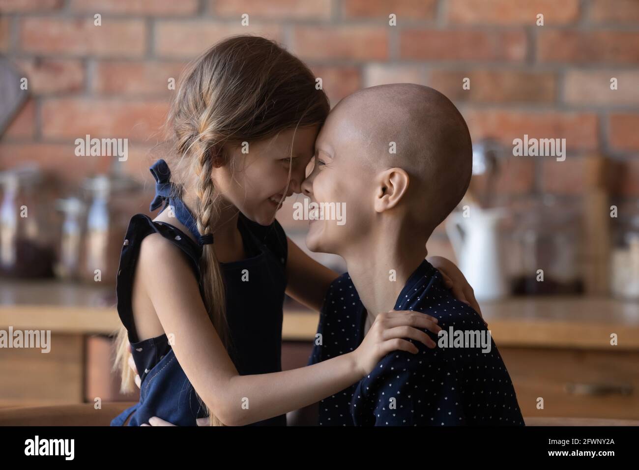 Happy mom with cancer and positive little daughter girl Stock Photo - Alamy