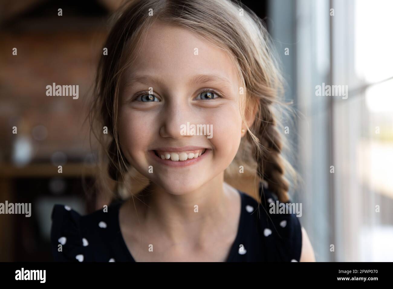 Portrait of happy cute kid, looking at camera and smiling Stock Photo ...