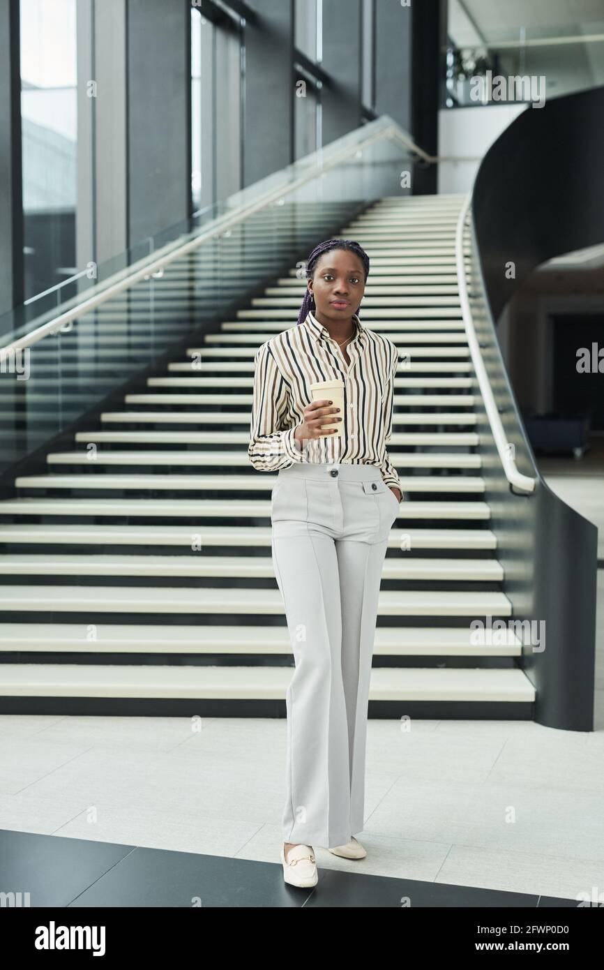 Graphic full length portrait of confident African-American ...