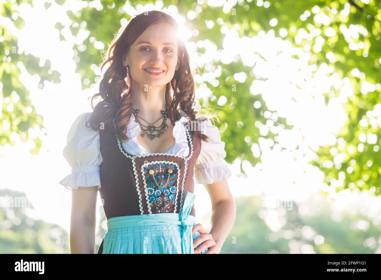 Beautiful woman wearing traditional dirndl hi-res stock photography and ...