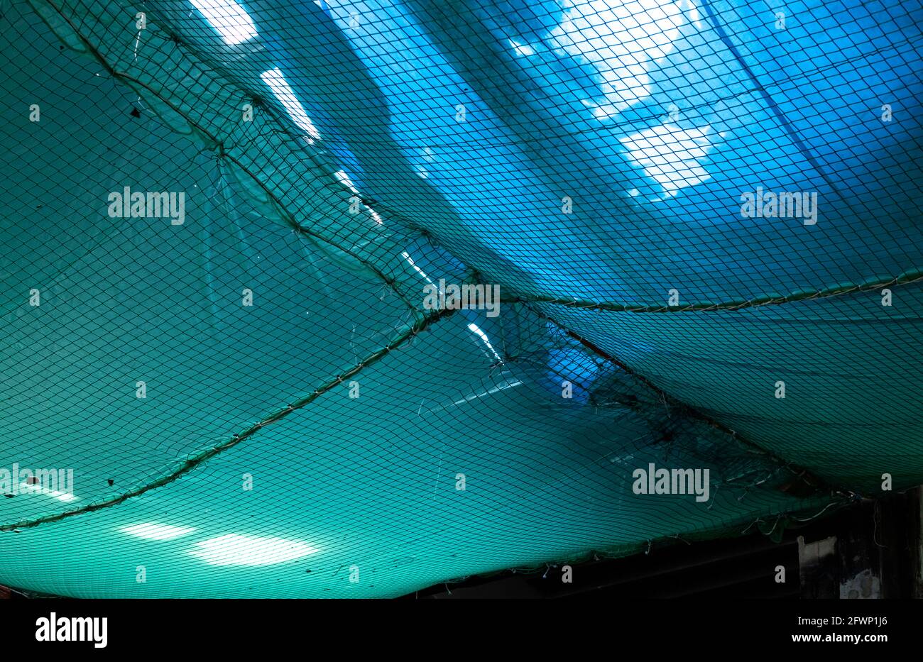 a regulatory safety net of color green, placed under roof to prevent ...