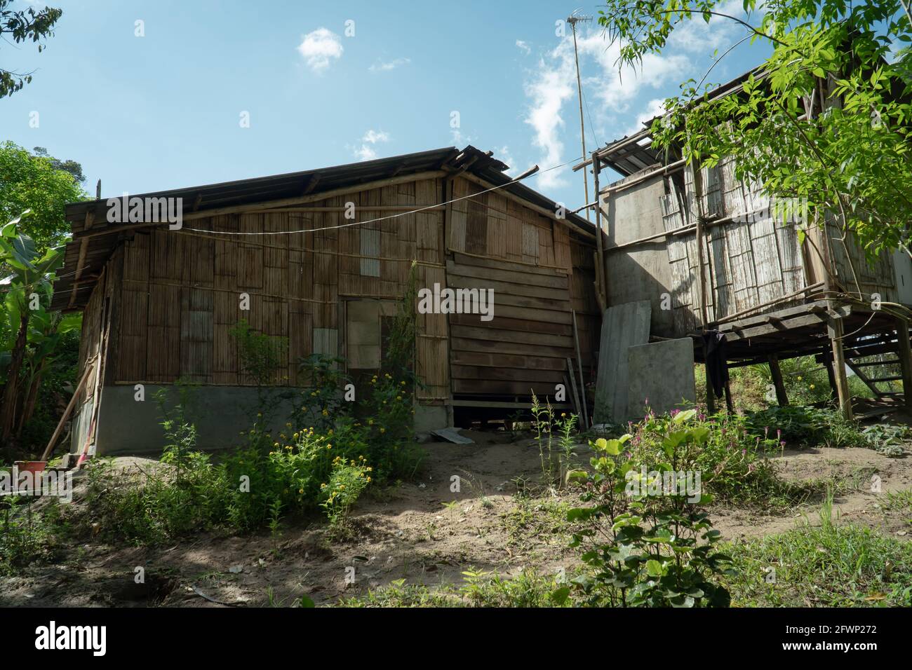 Traditional asian old wooden house surrounded with nature in Malaysia ...