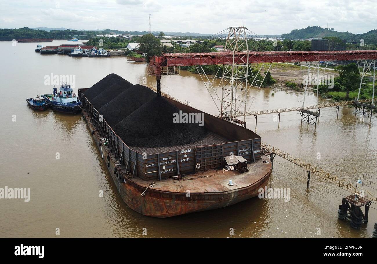 loading coal into barges from stock pile aerial view Stock Photo - Alamy