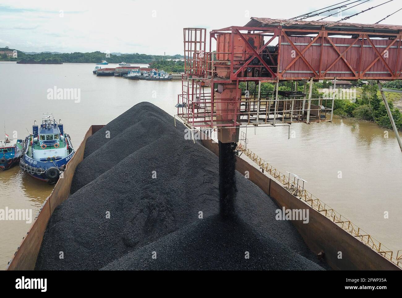 loading coal into barges from stock pile aerial view Stock Photo - Alamy