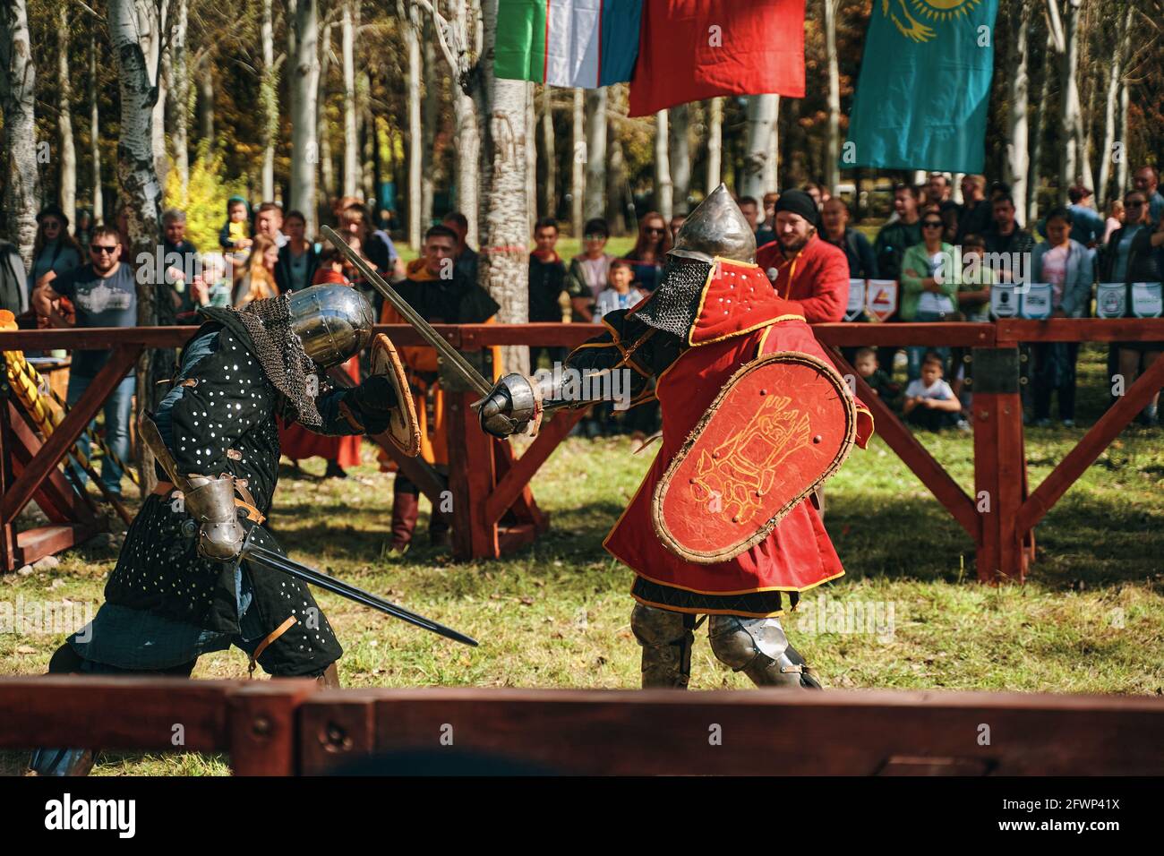Battle of knights in the arena. Swords, shields, helmets and armor on ...