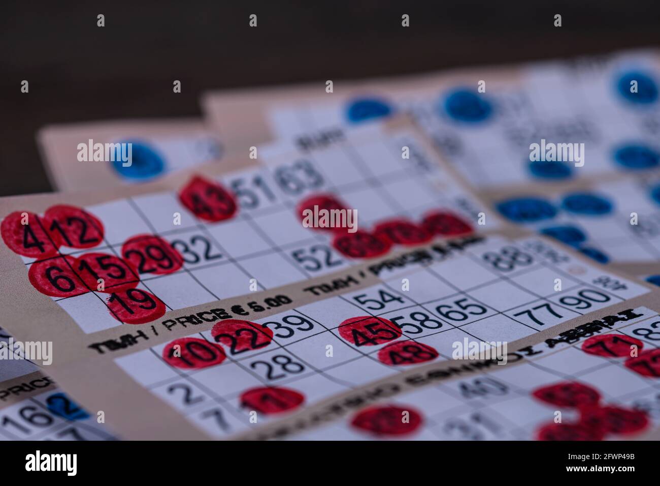 Red and blue marked Bingo cards close up Stock Photo - Alamy