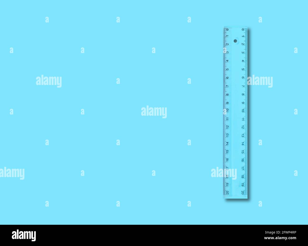 Science and education - Plastic blue school ruler isolated on a blue ...