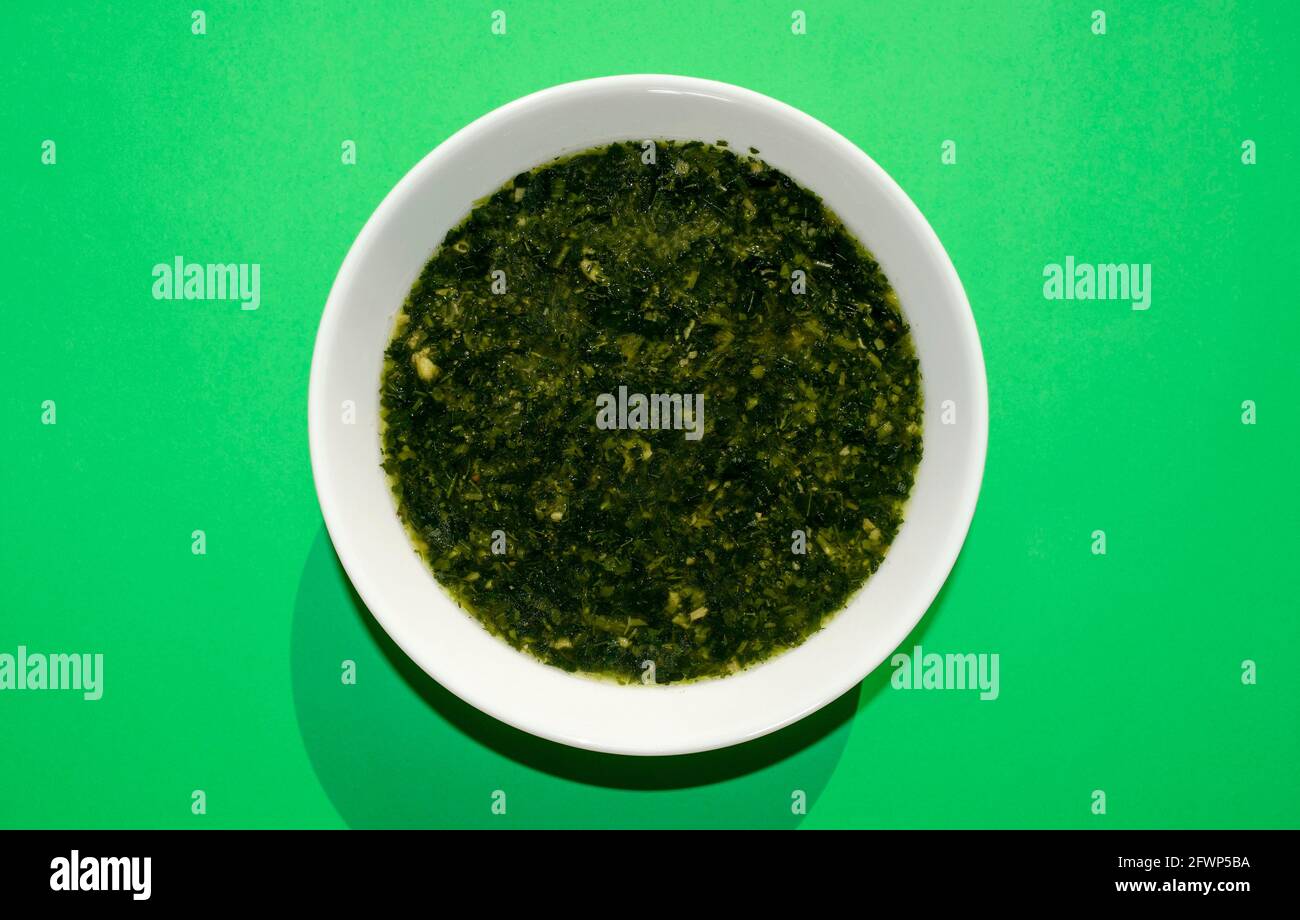 Famous traditional Arabic cuisine. Molokhia soup in a white bowl on a ...