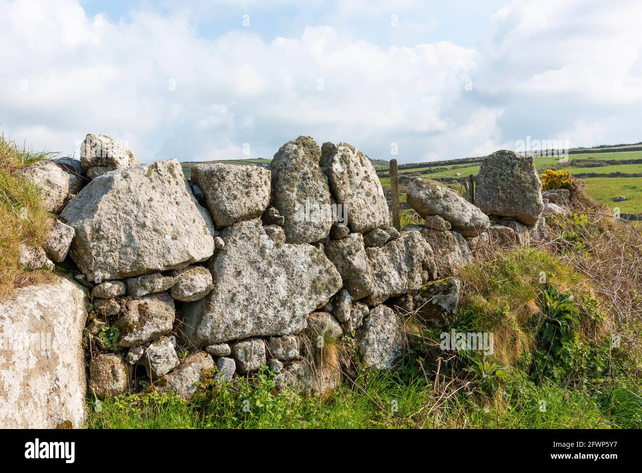 An old wall constructed with huge granite boulders in the West Penwith ...