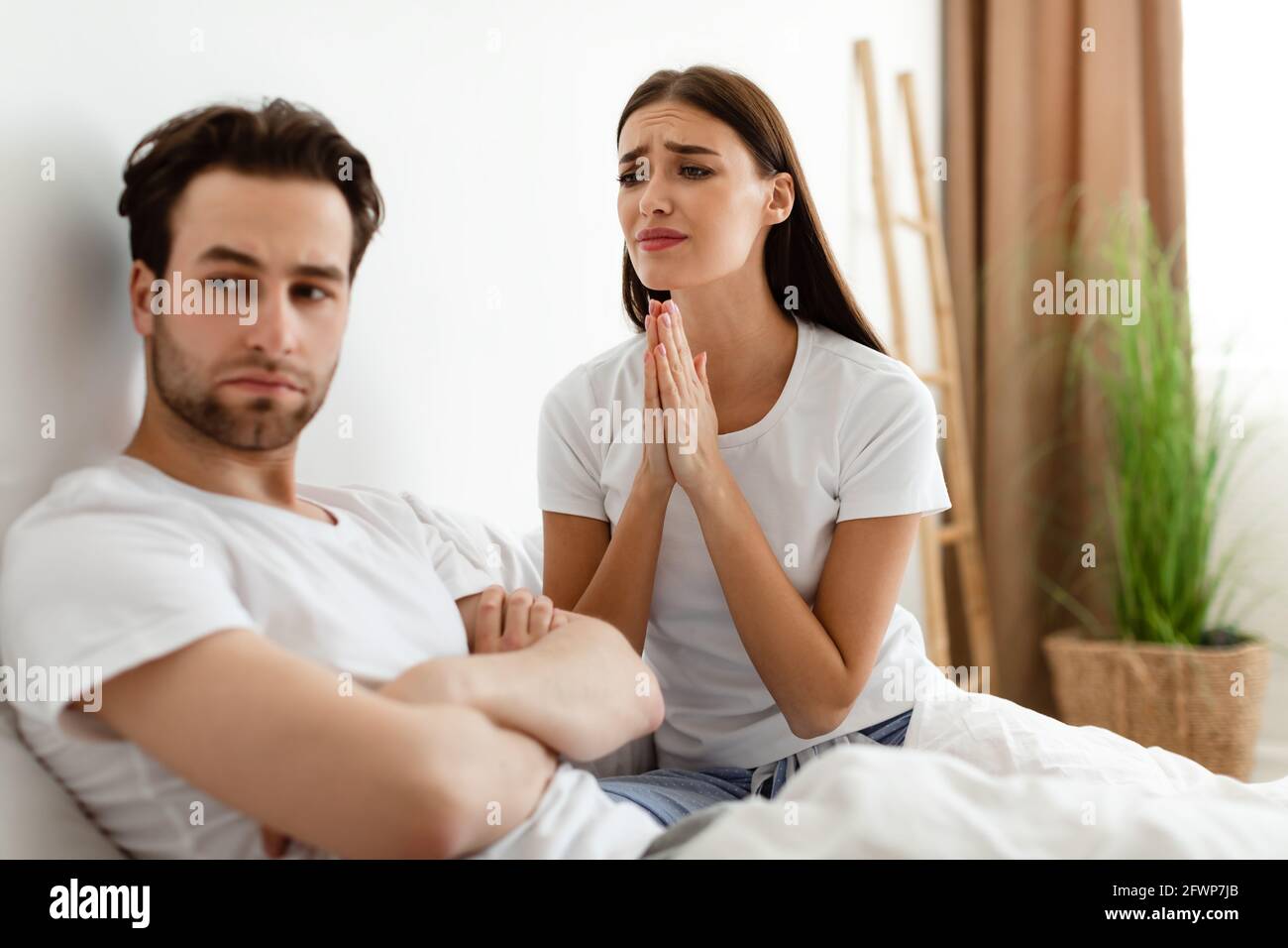 Man pleading with his wife hi-res stock photography and images - Alamy