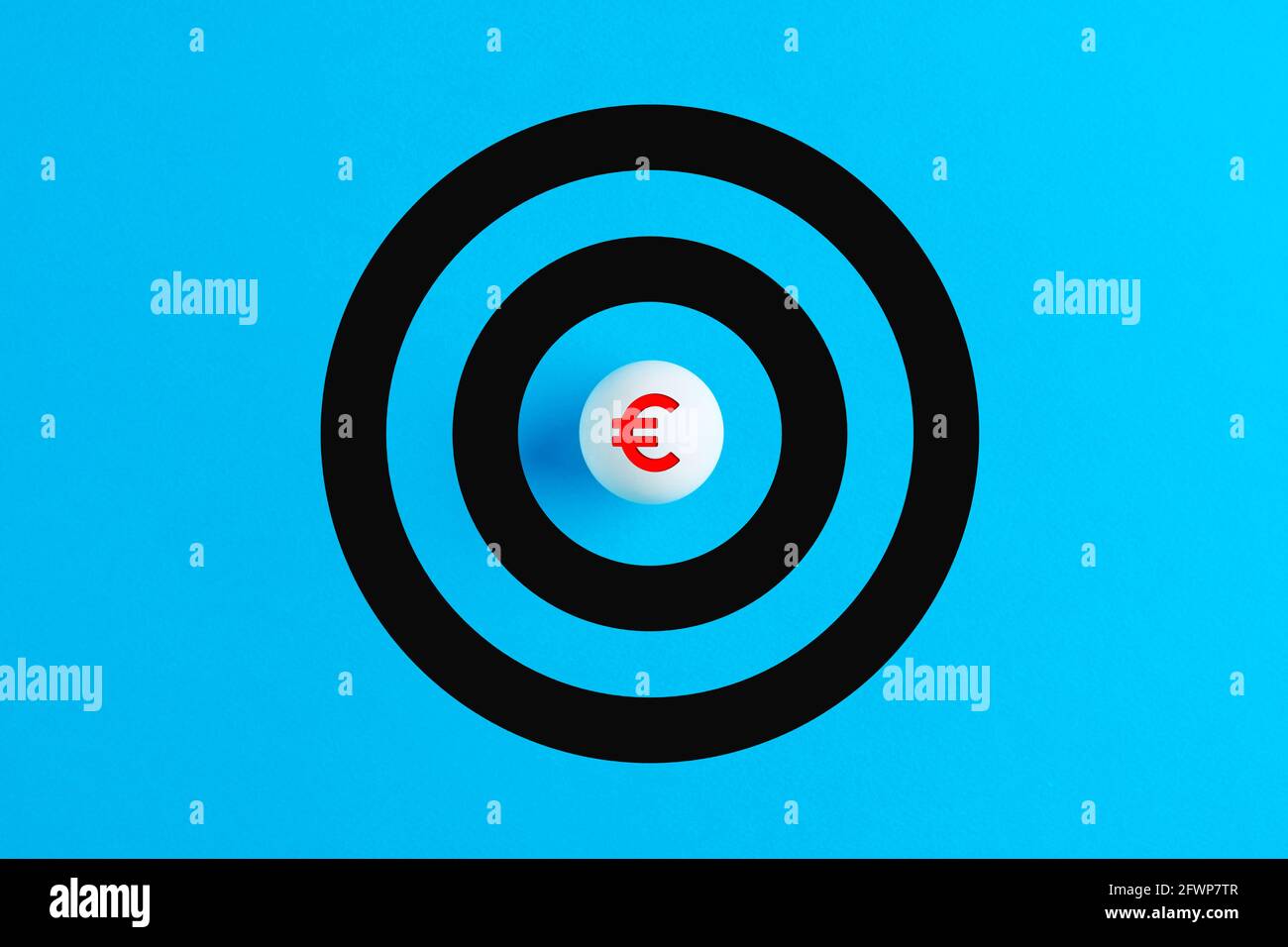 Ball with euro symbol as the bulls eye of a target. Financial goals or ...