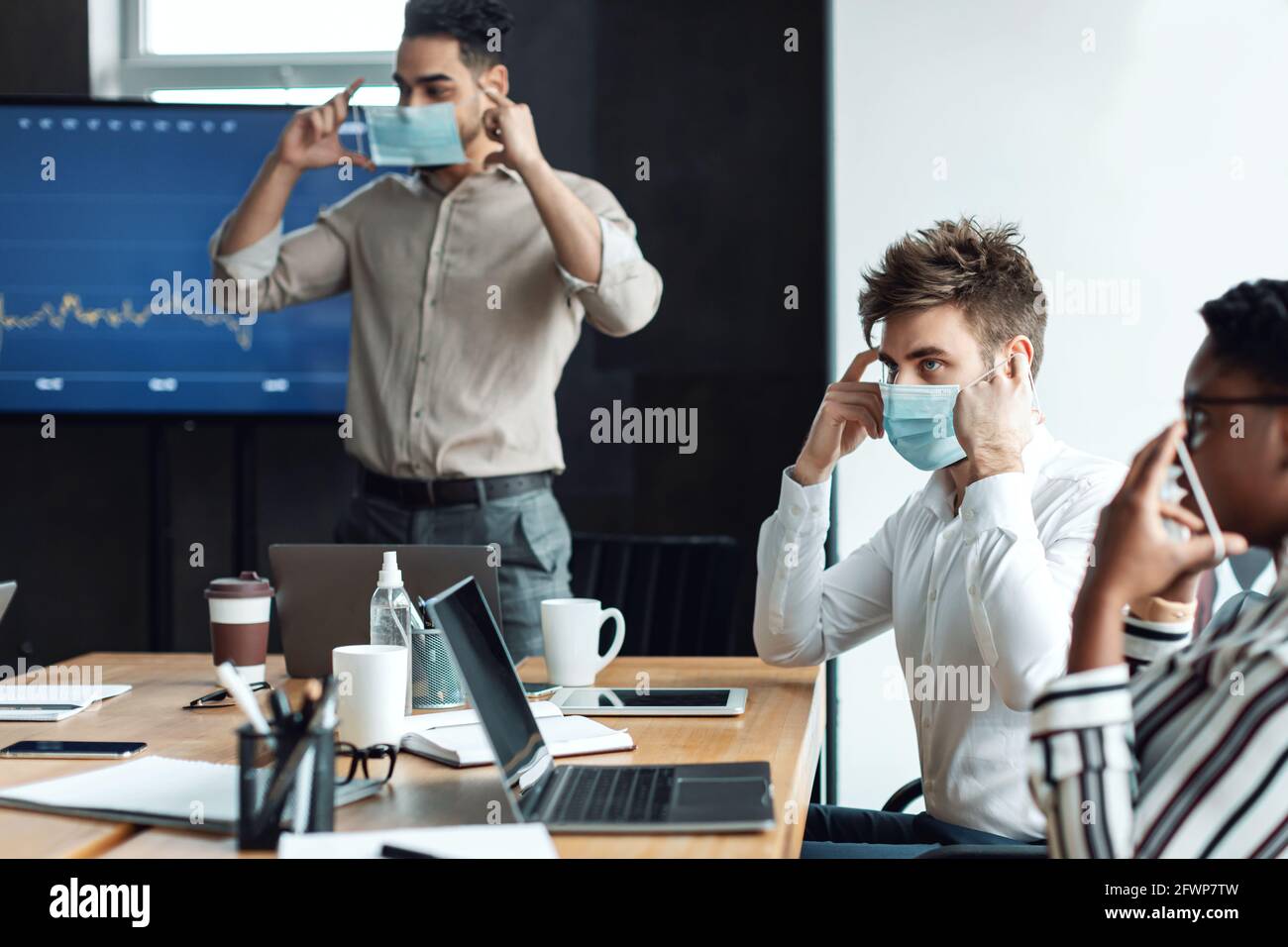 International people wearing medical masks at work Stock Photo - Alamy