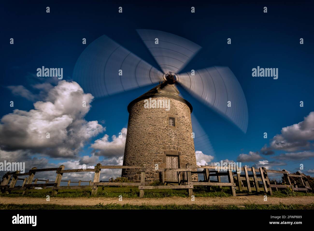 idyllic windmill in the Normandy region of france with moving blades ...