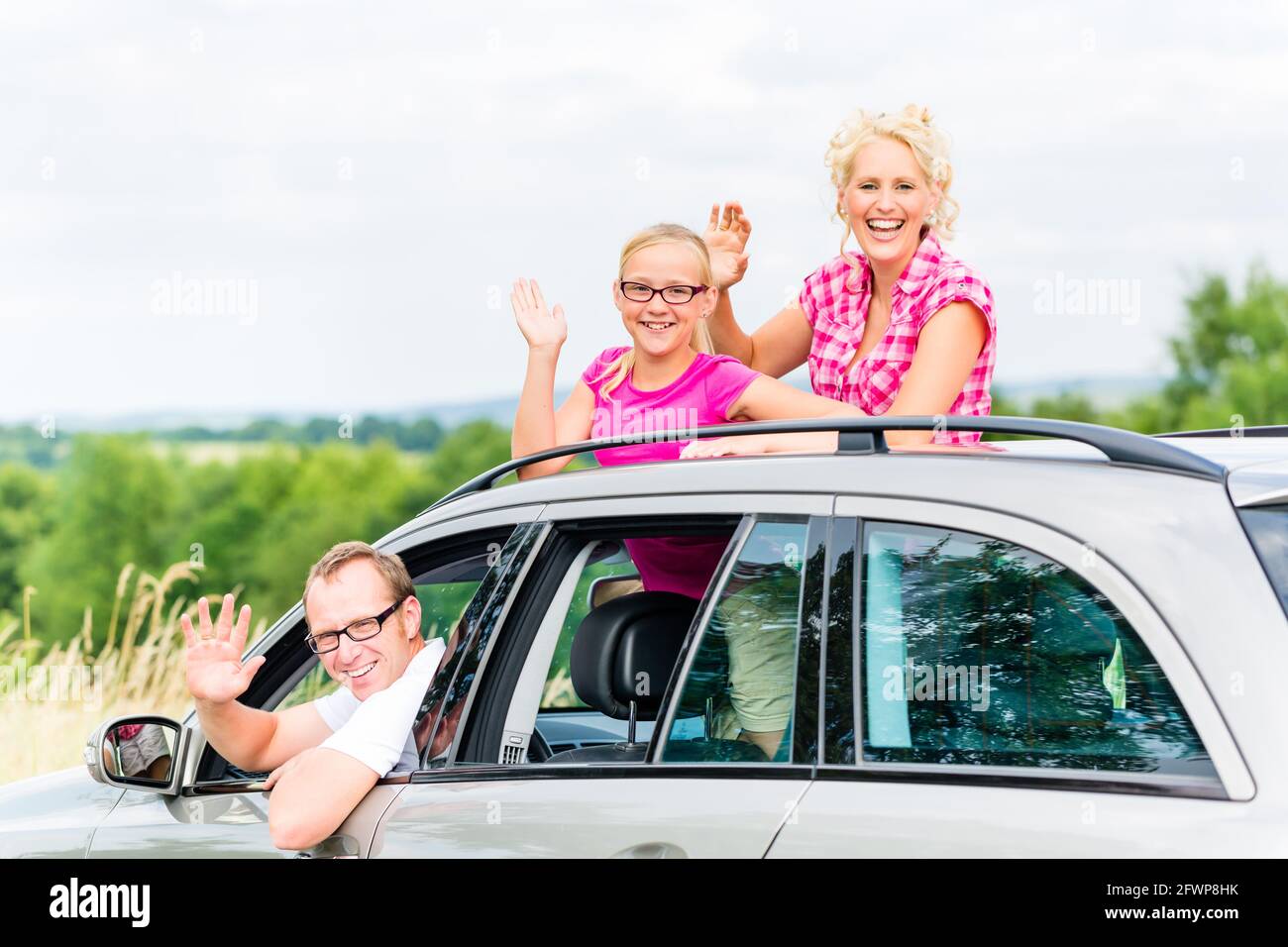 Family driving in car Stock Photo - Alamy