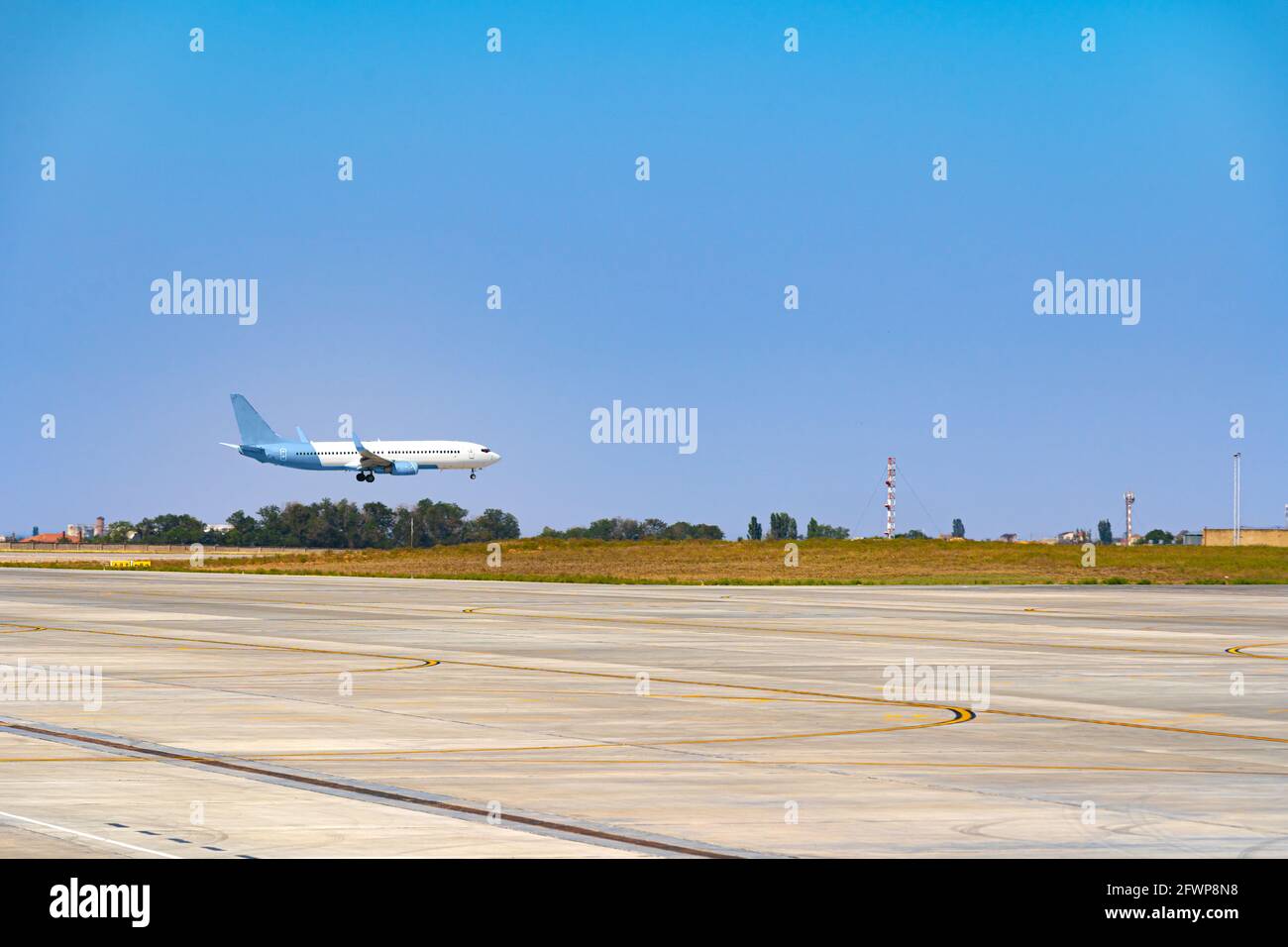 Passenger plane takes off from runway in airport Stock Photo - Alamy