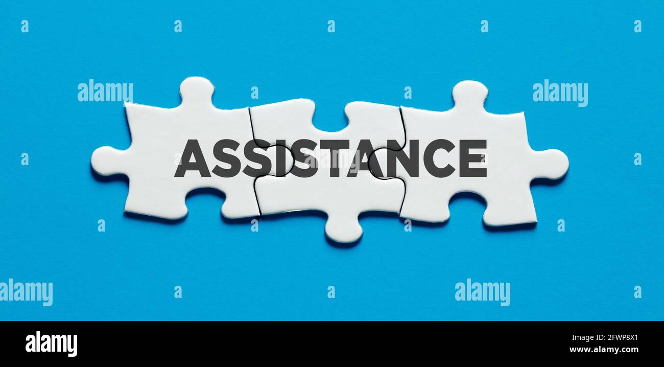 The word assistance on connected jigsaw puzzle pieces. Customer support ...