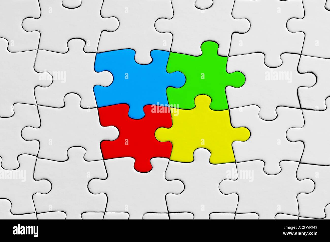 Colorful jigsaw puzzle pieces stand out from the crowd. Diversity ...