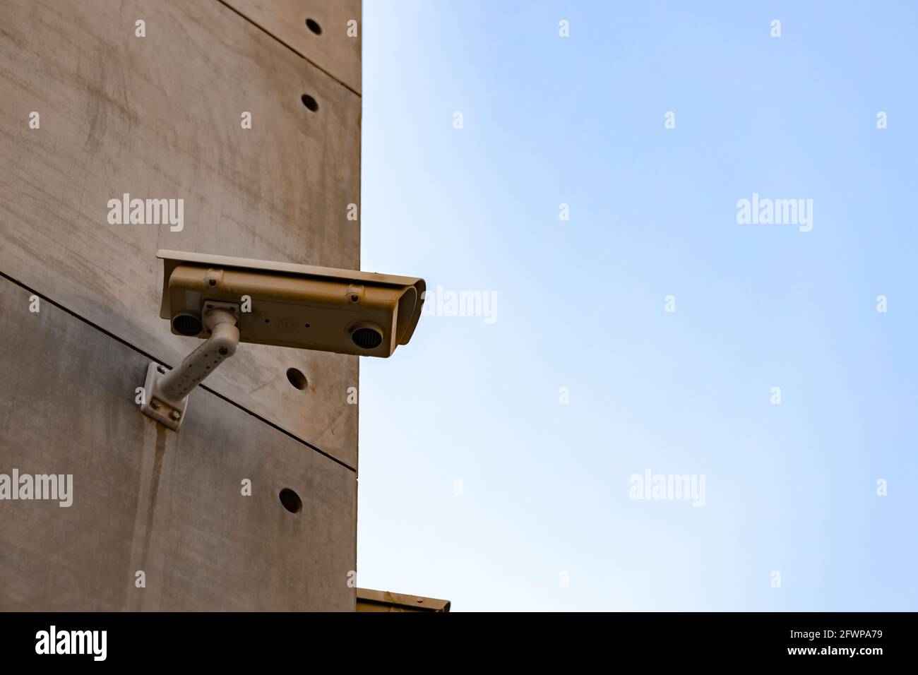 Security CCTV camera on facade of building Stock Photo - Alamy