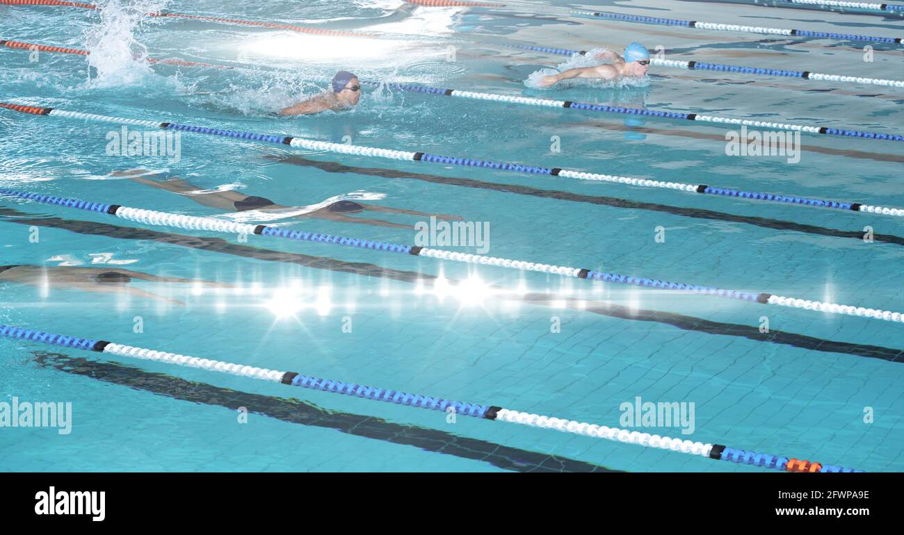 Composition of men swimming in swimming pool Stock Photo - Alamy