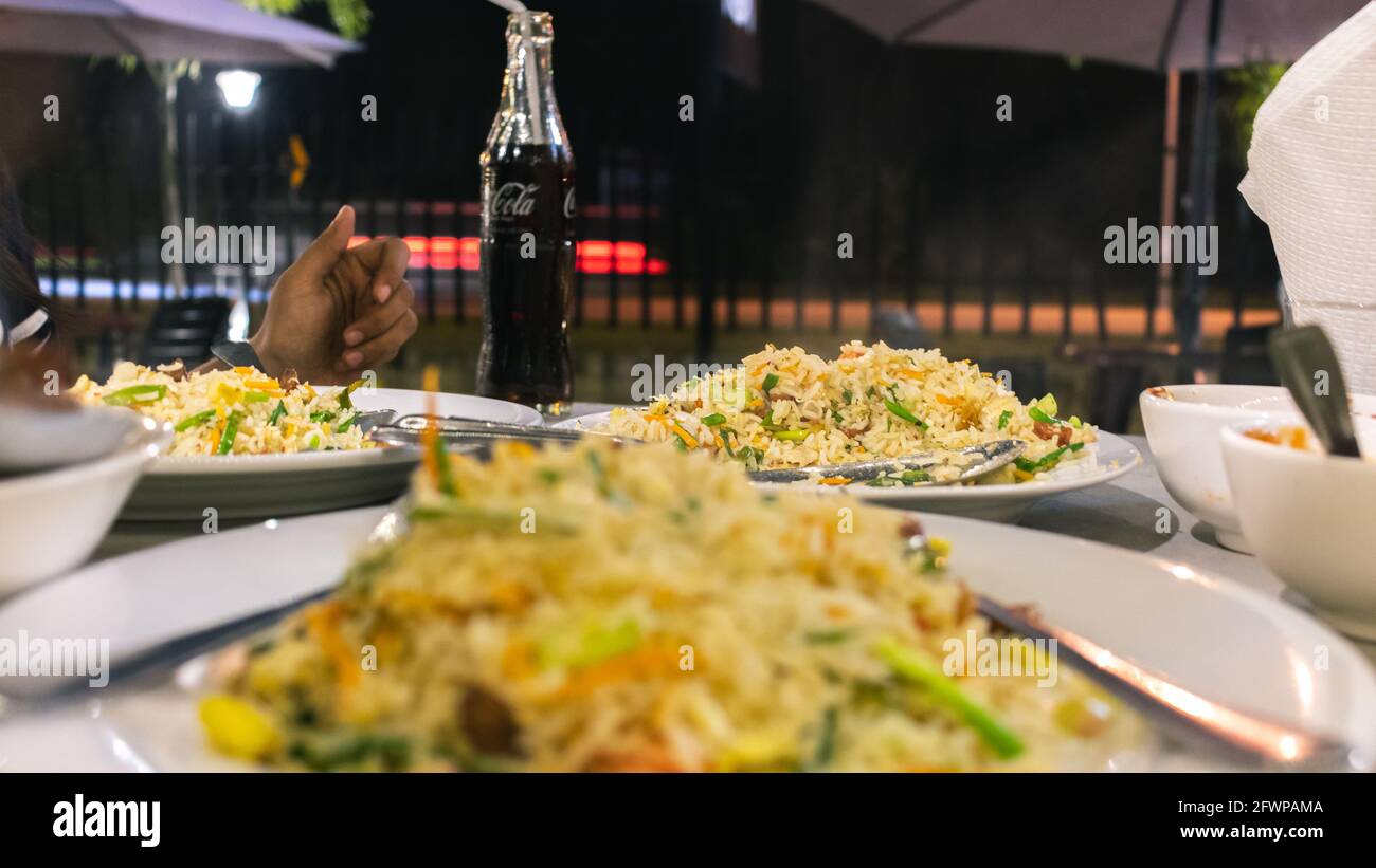 Chicken mix Fried rice dinner plate and a beverage at an outdoor ...