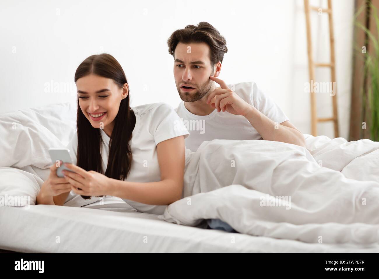 Suspicious Husband Reading Cheating Wife's Messages Behind Her Back ...