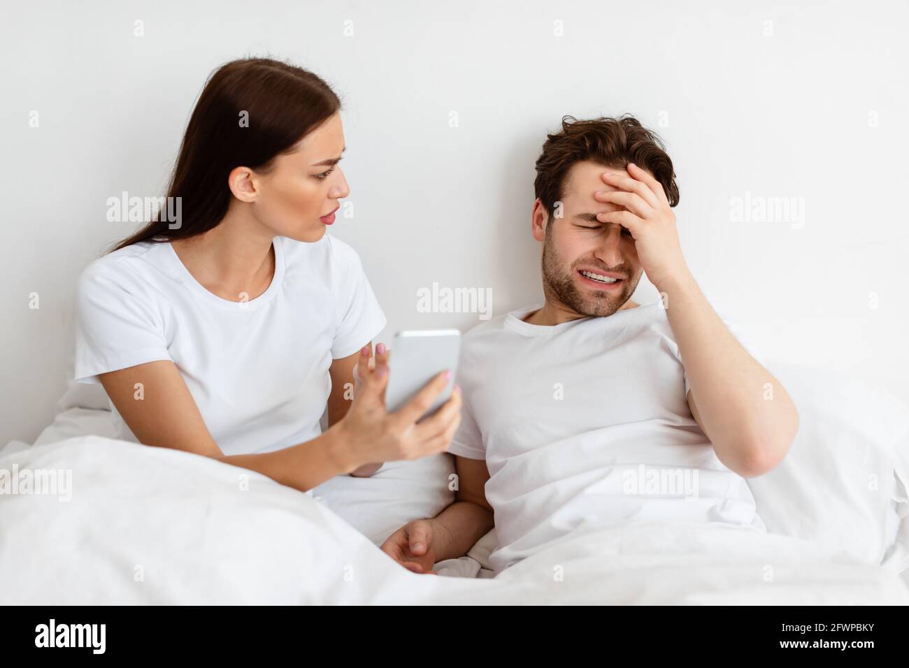 Jealous Wife Showing Cheating Husband His Phone Demanding Explanation ...