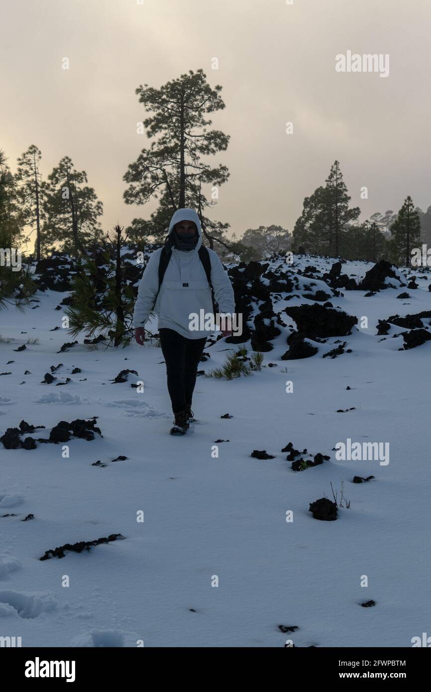 young boy in white jacket and backpack in snow Stock Photo - Alamy