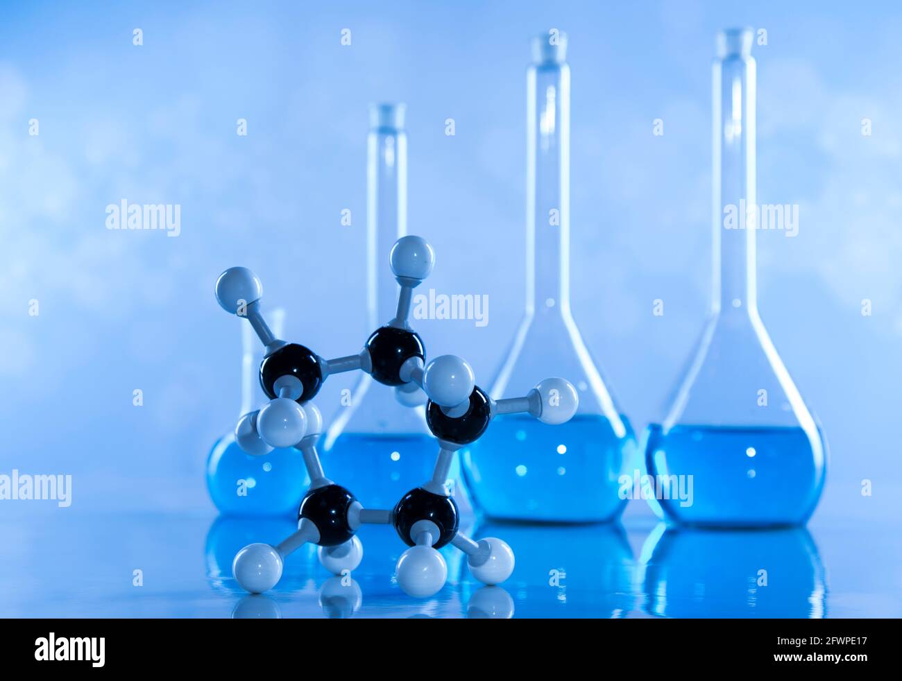 Laboratory beakers,Science experiment, blue background Stock Photo - Alamy