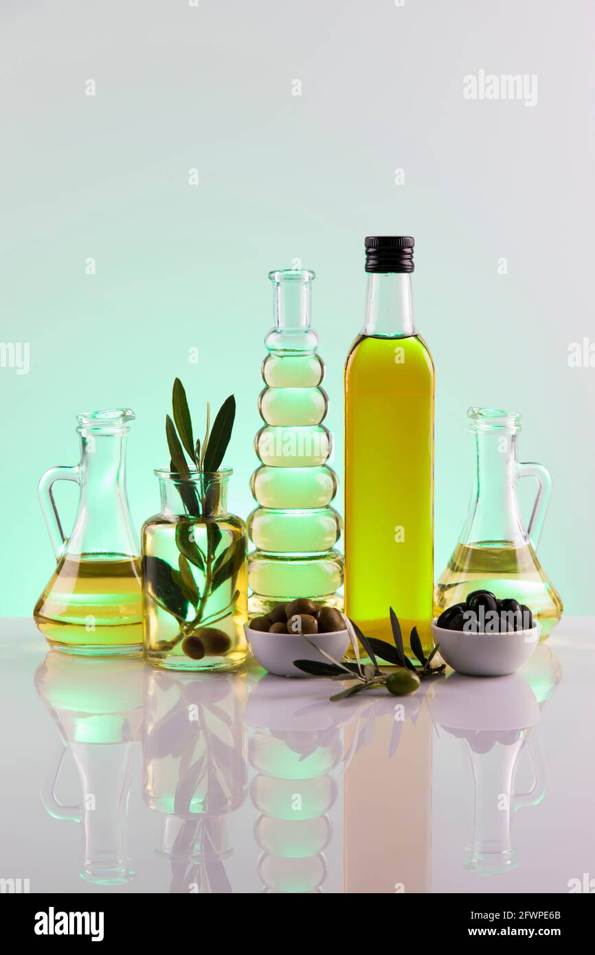 Bottles of olive oil, olive branch and Cooking oils Stock Photo - Alamy