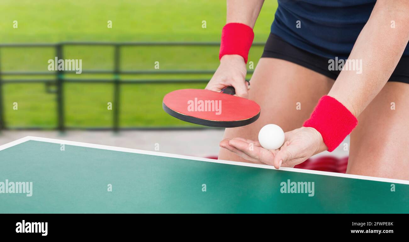 Composition of mid section of female table tennis player holding ball ...