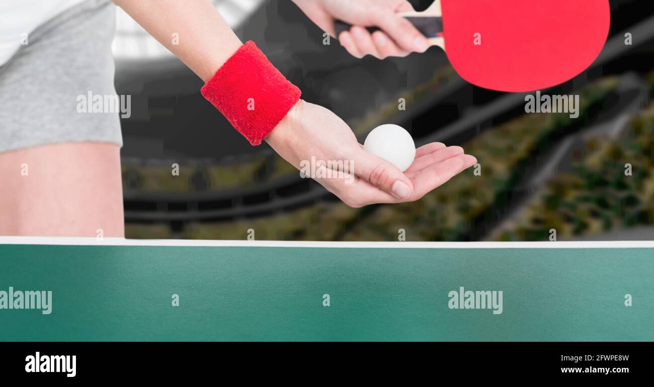 Composition of mid section of female table tennis player holding ball ...