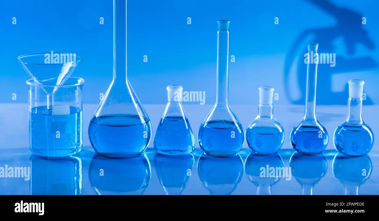 Laboratory equipment, glass filled background Stock Photo - Alamy