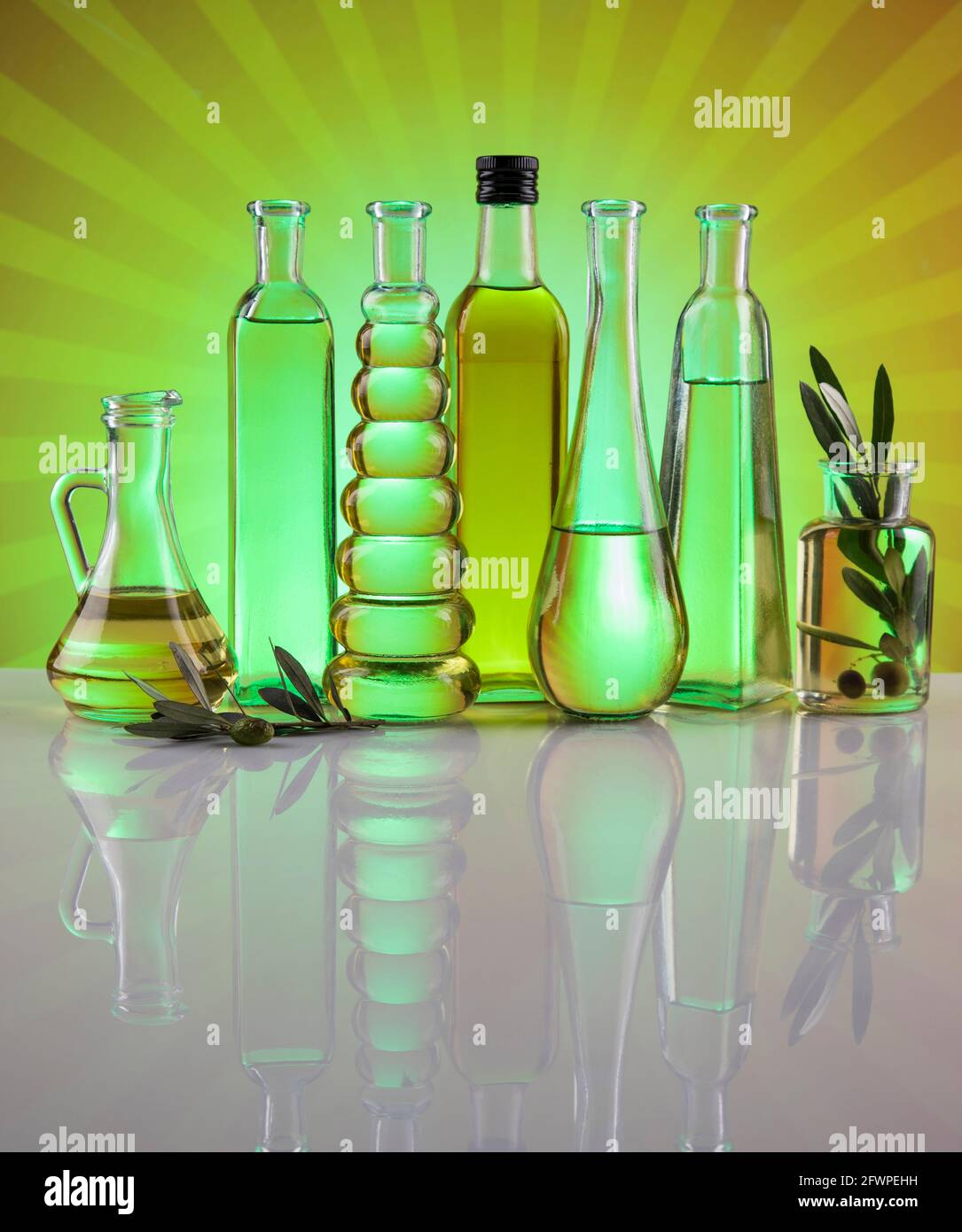 Bottles of olive oil, olive branch and Cooking oils Stock Photo - Alamy