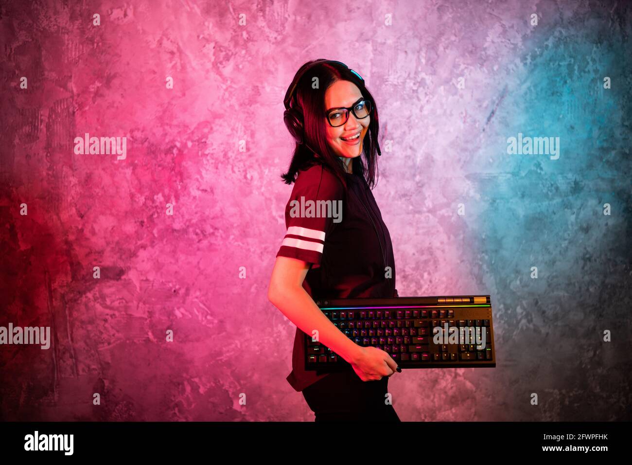 Professional Girl Gamer in MMORPG Strategy Video Game. She's She posing ...