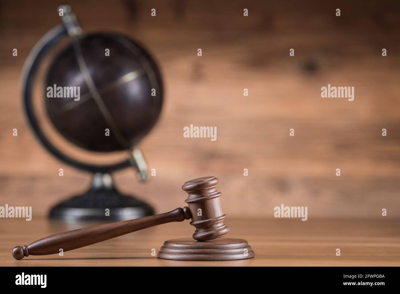 Law theme, mallet of judge, wooden gavel, globe background Stock Photo ...