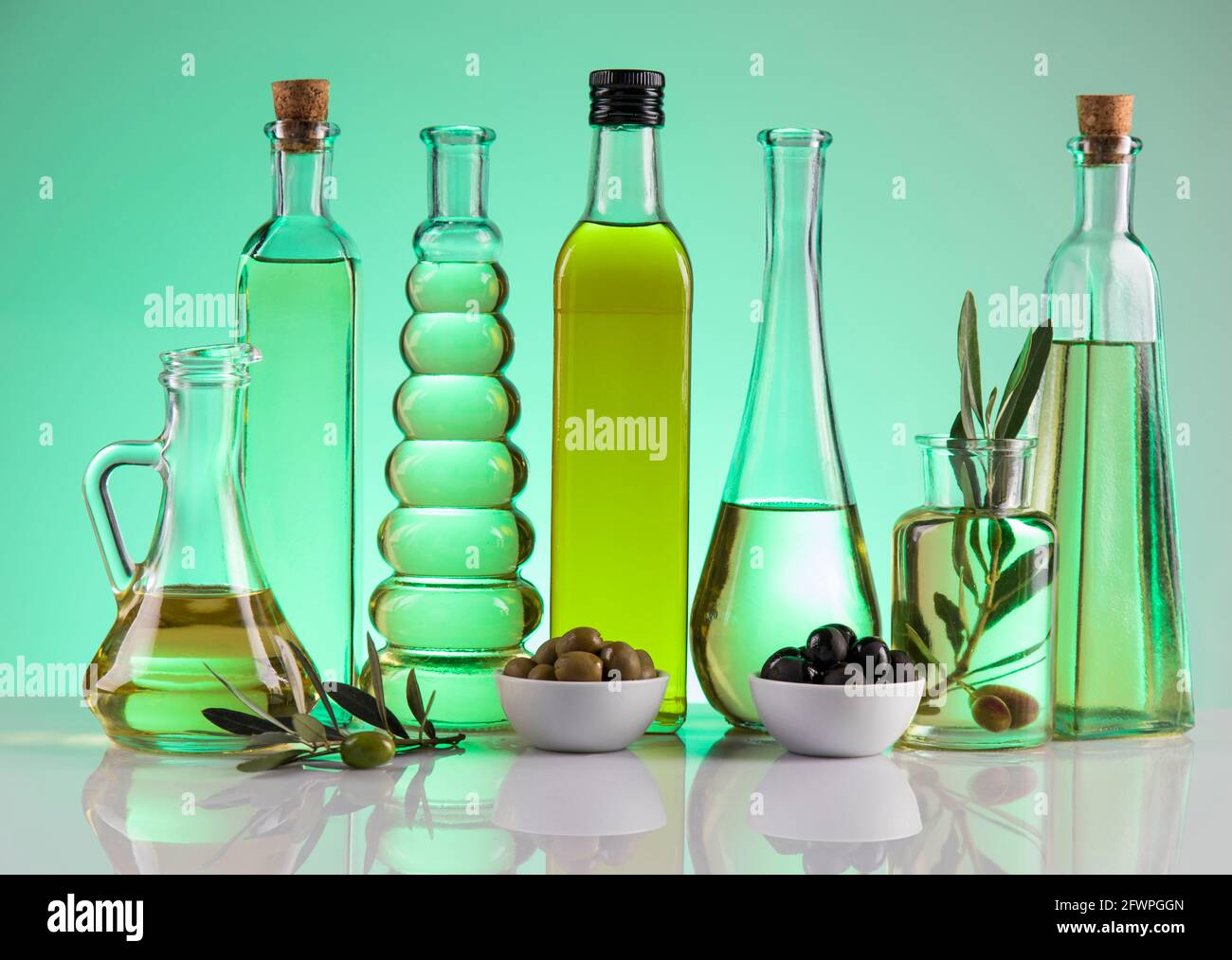 Bottles of olive oil, olive branch and Cooking oils Stock Photo - Alamy