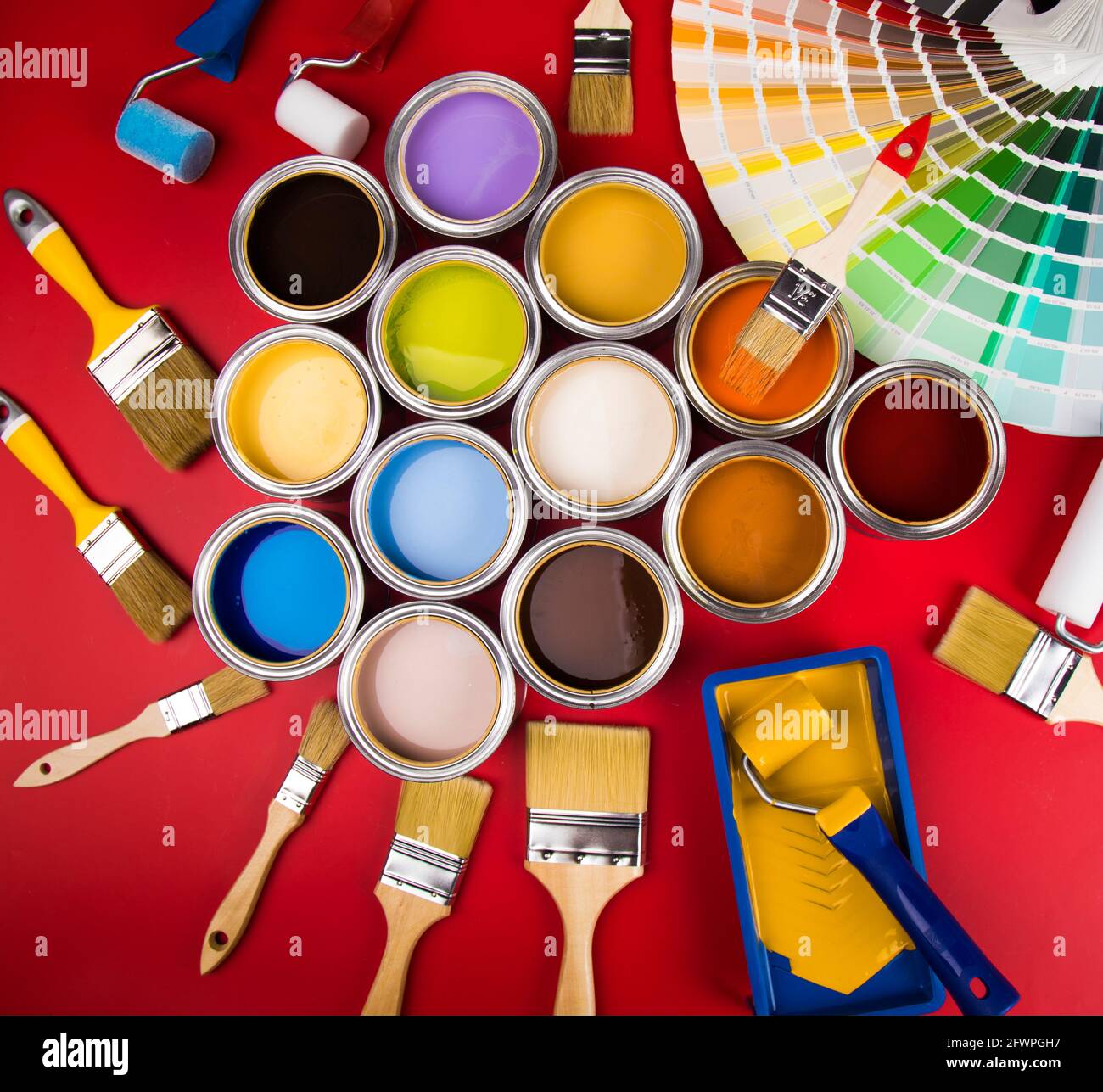 Paint brush, tin can and color guide samples Stock Photo - Alamy